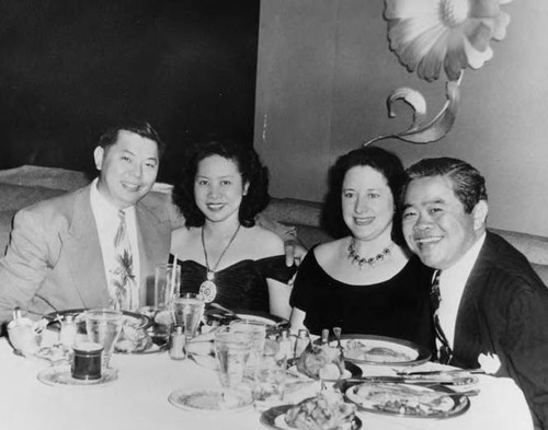 Mr. and Mrs. James Wong Howe (Sanora Babb Howe) dining with friends ...