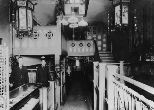 George C. Lem on the left inside of Lem's Cafe — Calisphere