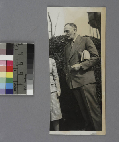 Edwin Powell Hubble wearing a double-breasted suit, with books in his ...