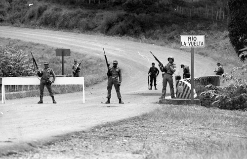 Costa Rican Civil Guards near a bridge, Costa Rica, 1979 — Calisphere
