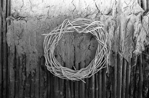 Wreath hanging on a wattle and daub wall, San Basilio de Palenque, 1977 ...