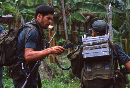 Contra completes a radio call, Nicaragua, 1983 — Calisphere