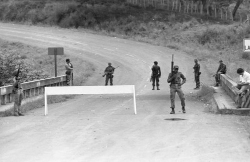 Costa Rican Civil Guards near a bridge, Costa Rica, 1979 — Calisphere