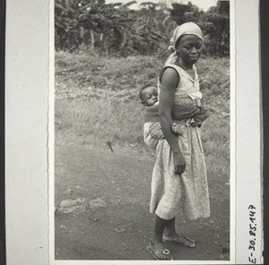 A young mother with her child; from the tribe of the Bafo in Kumba ...