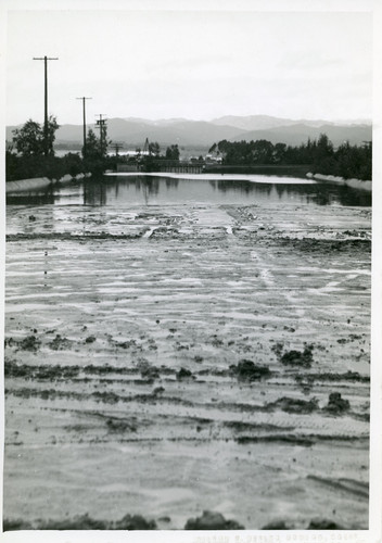 Oxnard underpass cross during flood — Calisphere