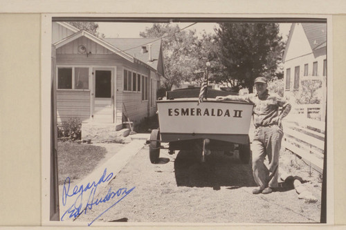 Ed Hudson posing at the stern of his "Esmeralda II" at the rear of his ...