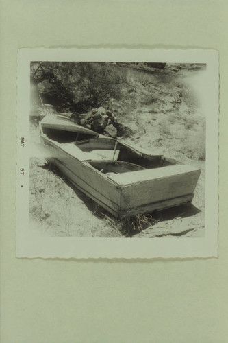 Bert Loper's wrecked boat going to pieces on the bank near Mile 41 ...