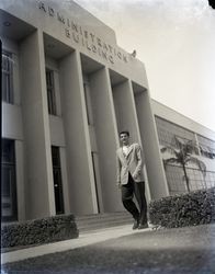 Dutch angle Administration Building with walking student — Calisphere