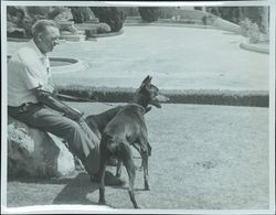 Rick Urlich and dog in yard — Calisphere