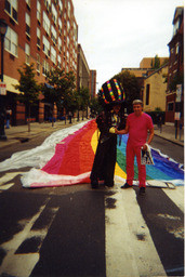 Gilbert Baker with large parade flag — Calisphere
