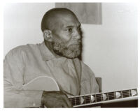 Calvin Keyes playing the guitar in Los Angeles [descriptive] — Calisphere