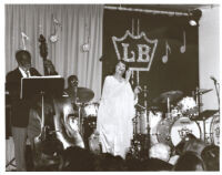Ruth Price singing on stage, Los Angeles [descriptive] — Calisphere