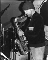 Don Menza performing on a decorated sax [descriptive] — Calisphere