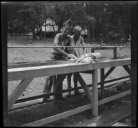 Harry Lawrence and Otto Pease wash their clothes at Big Pines Scout ...