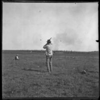 William Mead shooting a clay blackbird, Biddick, 1900 — Calisphere