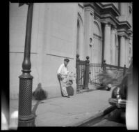 Praline vendor stands outside St. Louis Cathedral, New Orleans, 1947 ...