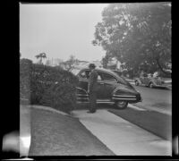 Will Witherby stands beside a car outside Zetta and Dode Witherby's ...