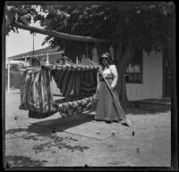 Frances Nichols posing next to a hammock at Nichols Ranch, Santa Ana ...