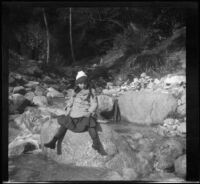 Elizabeth West sitting on a rock in a stream, Mount Wilson, about 1909 ...