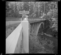 Arch bridge spanning the Smith River, Del Norte County, 1942 — Calisphere