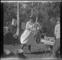 Edith Shaw dries a bowl while Forrest Whitaker smokes a pipe behind her ...