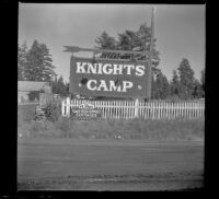 Signage for Knights Camp sitting along the roadside, Big Bear Lake ...