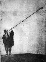Photo of painting [?] of man playing clarín, long trumpet-type ...
