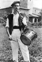 Closeup shot of Basque musician playing the txistu and the tanborin ...