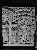 Ornated female figures standing under arch-vaulted gateway — Calisphere