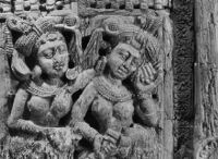 Ornated female figures standing under arch-vaulted gateway, detail ...