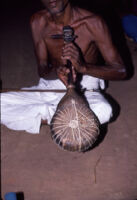 Sarpam Thullal Pulluvan Serpent Ritual - O. K. Raman holding a Pulluvan ...