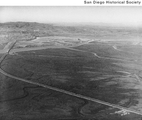 Aerial view of a curving road and two bridges at Mission Bay leading to ...
