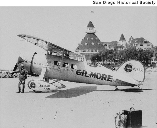 Roscoe Turner standing with his airplane, the Gilmore Lion, at the ...