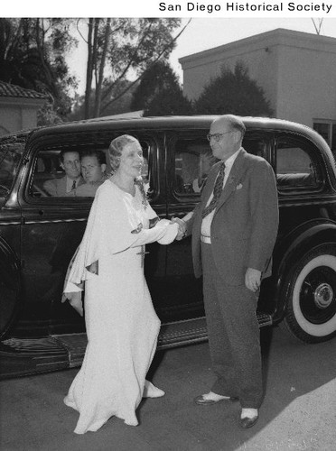 Aimee Semple McPherson shaking hands with Elwood Bailey next to an ...