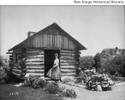 Miss Littlefield standing in the entrance to a cabin in Pacific Beach ...