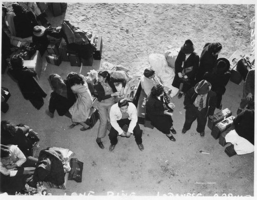 Japanese-Americans awaiting buses to Manzanar, April 1, 1941 — Calisphere