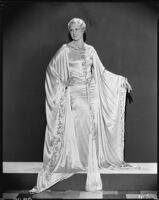 Peggy Hamilton modeling a Travis Banton "Grecian" style hostess gown of ...