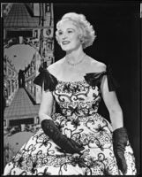 Peggy Hamilton modeling a dress with floral embroidery, 1933 — Calisphere