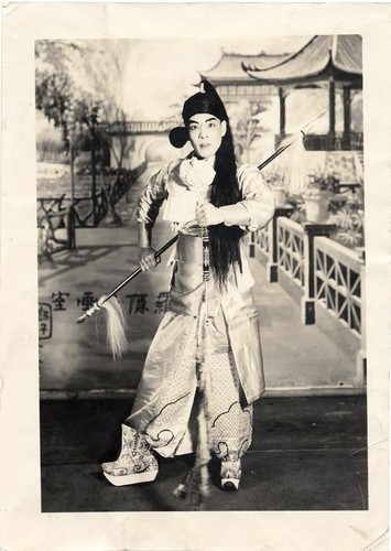 Ma Shi-tsang holding a spear and riding crop, possibly staged at the ...