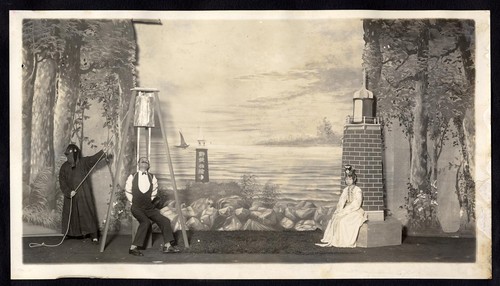 Man in Western dress is in danger of execution by hooded executioner, a ...