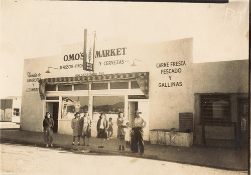 George Omo Sr.'s Family and Others in Front of Omo's Market — Calisphere