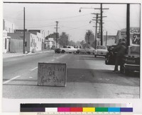 Handmade sign in the street, "Turn left or get shot," in front of ...