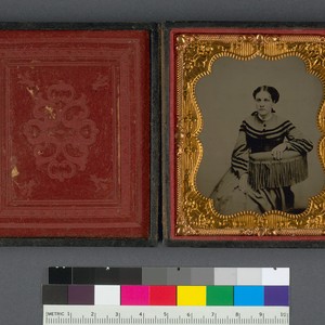 [Alonzo J. Doolittle in miner's clothing with a bag of gold] — Calisphere