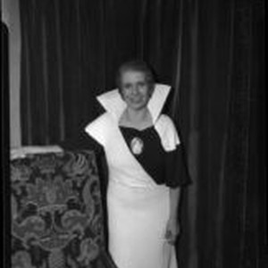 Evangelist Aimee Semple McPherson poses in evening dress — Calisphere
