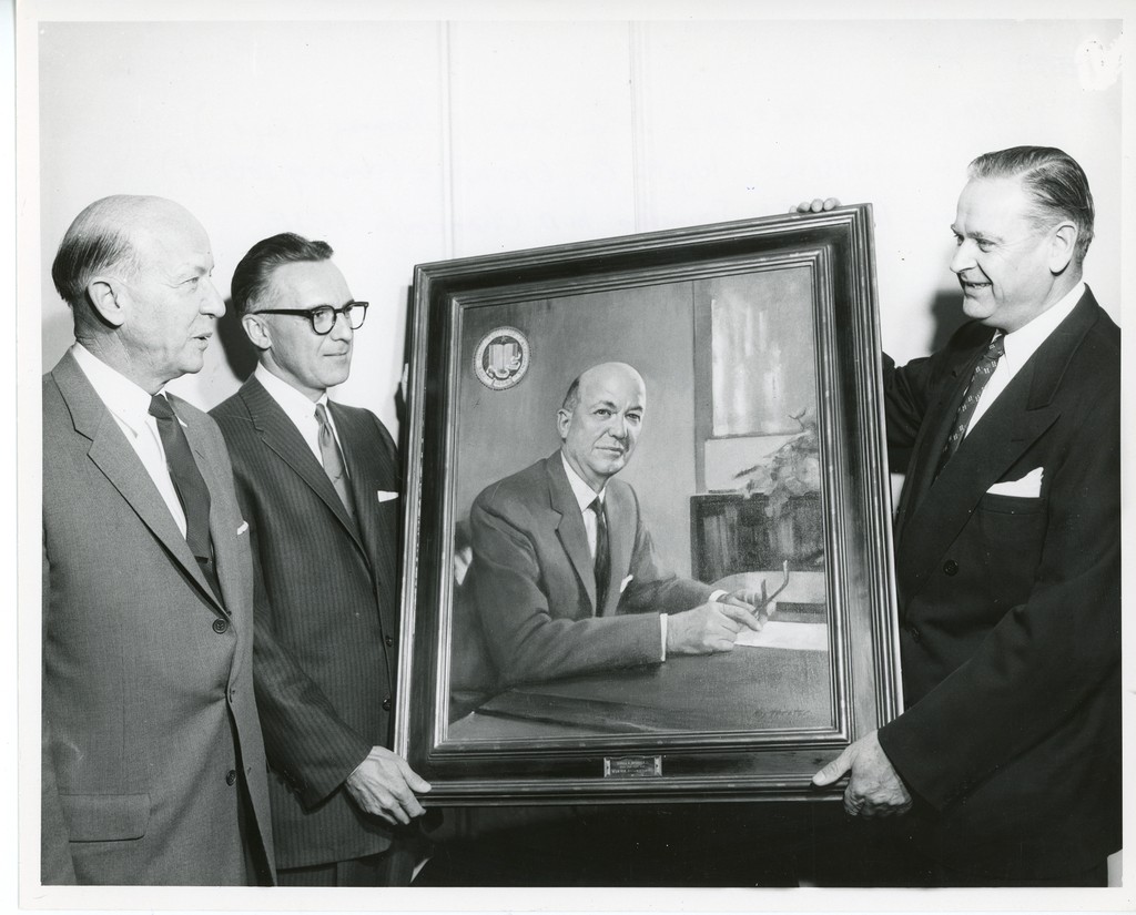 Portrait of Troy C. Daniels, PhD. Dean of School of Pharmacy (left). D ...