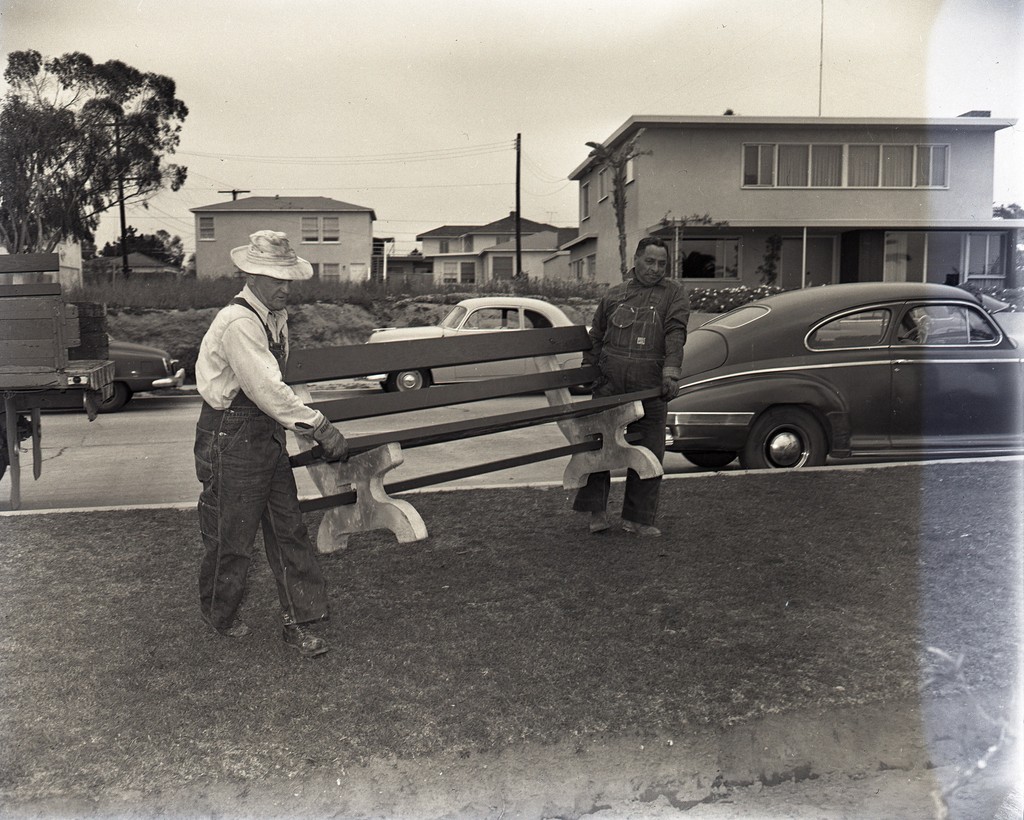 Street Department workers carrying a bench, Newport Beach, California ...