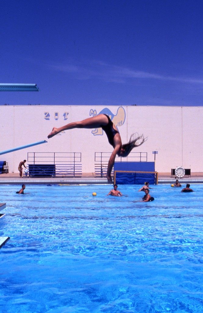 April Gibbs diving in the UCI pool. Images for View book. — Calisphere