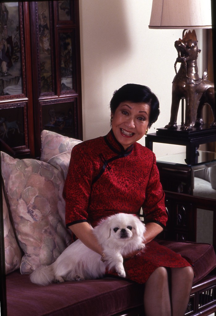 Mrs. Cheng with dog. — Calisphere