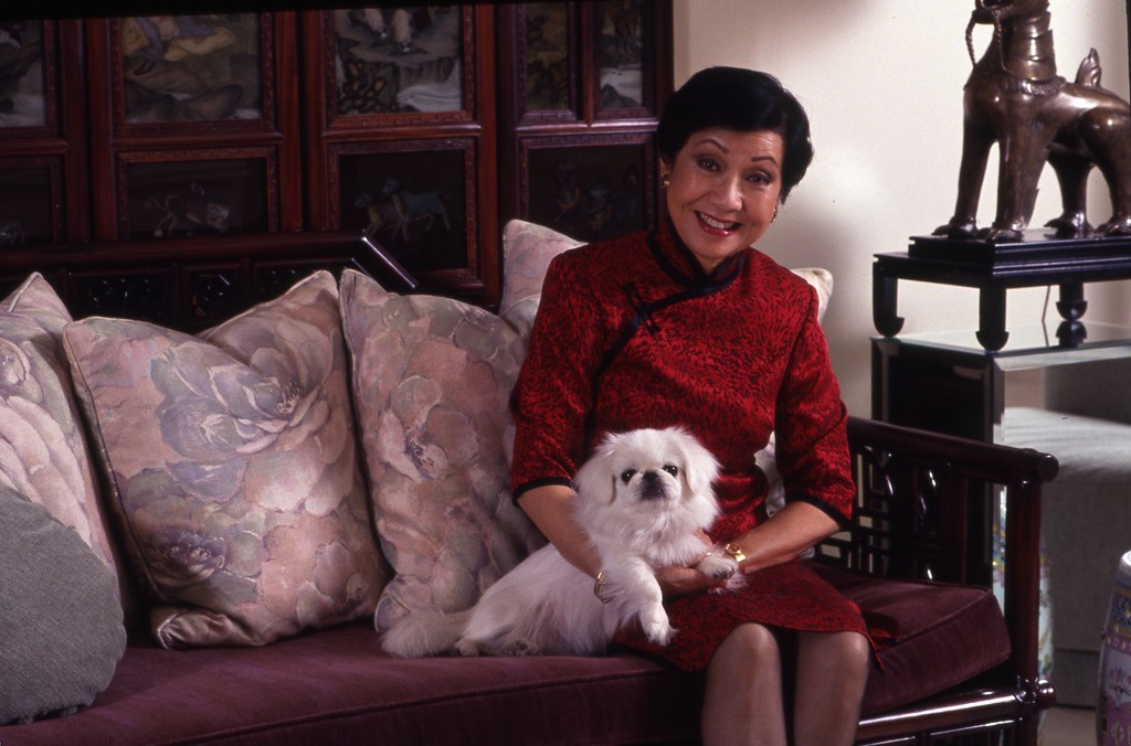 Mrs. Cheng with dog. — Calisphere