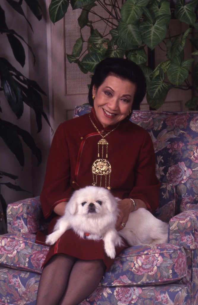 Mrs. Cheng with dog. — Calisphere